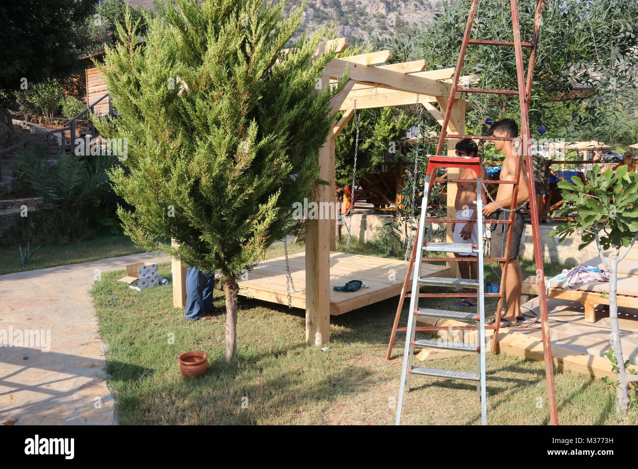 20TH JULY 2017, KABAK,TURKEY: Turkish workmen building a swing seat ...