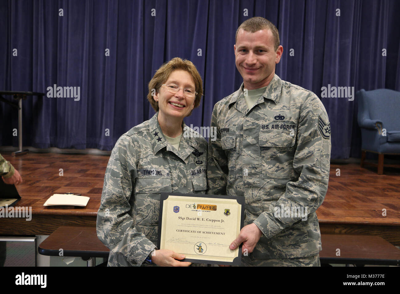 Maj. Gen. Carol Timmons presents a Certificate of Achievement to Staff ...