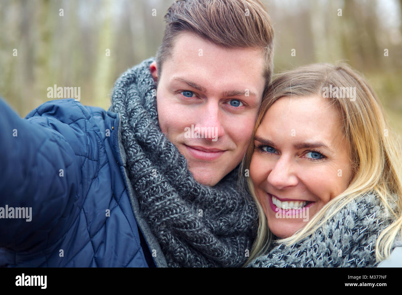 selfie of beautiful young couple outdoors in the cold Stock Photo - Alamy