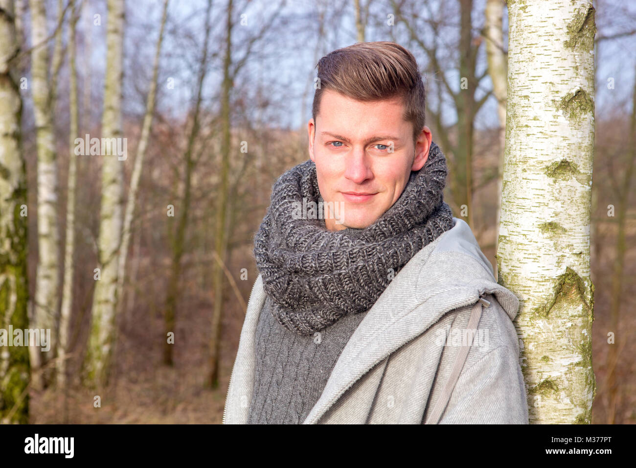 portrait of handsome blond man in forest in the cold Stock Photo - Alamy