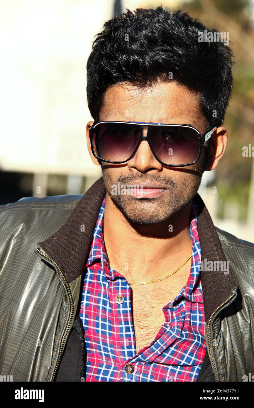 portrait of cool young man with sunglasses, outdoors Stock Photo - Alamy