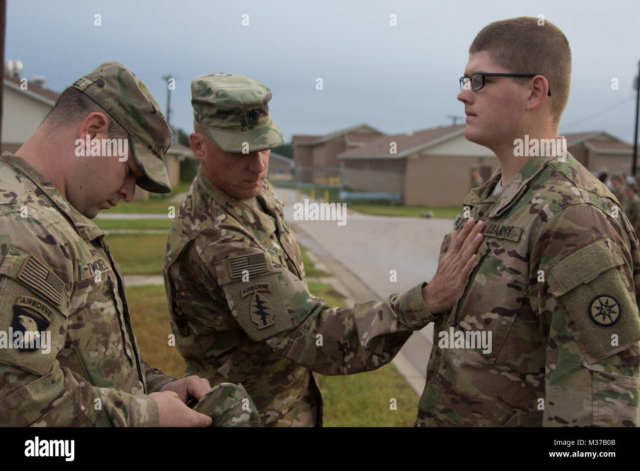 1st Sgt. Brian Jarvis advances Pvt. 1st Class Austen Thilges to the ...
