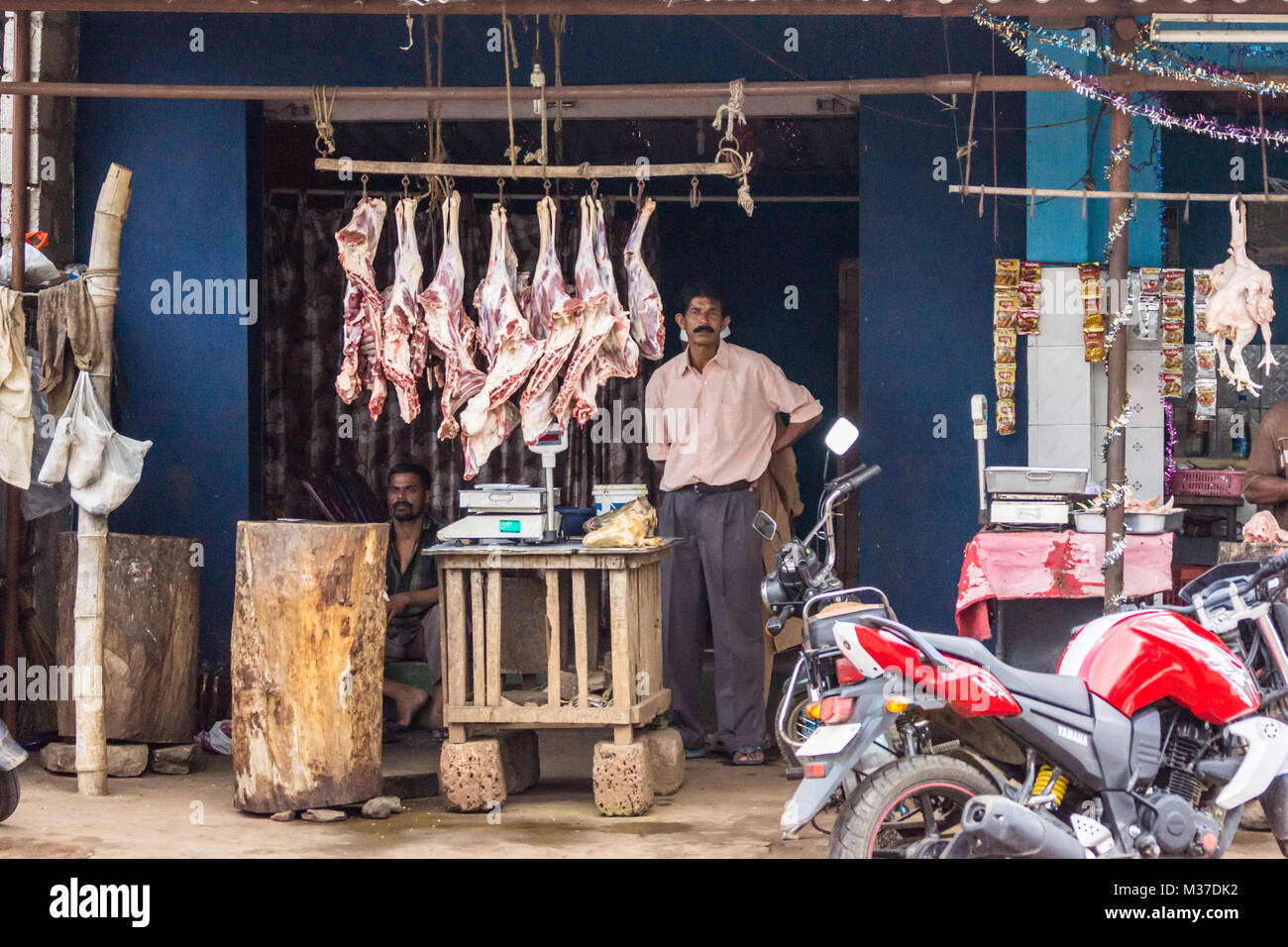 Coorg, India - October 29, 2013: Along street butcher shop with two ...
