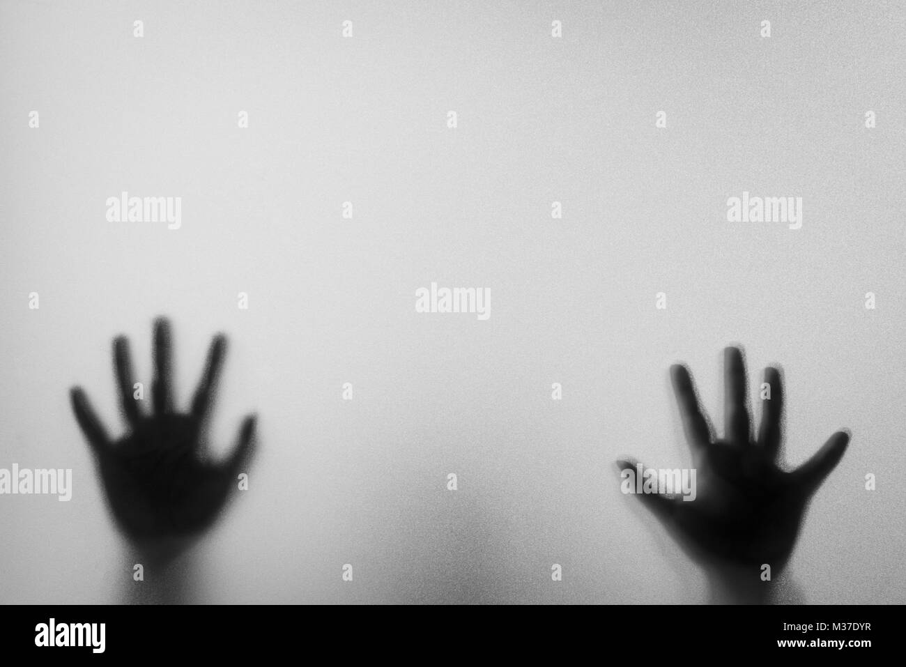 Shadow blur hands of the Man behind frosted glass.Blurry hand ...