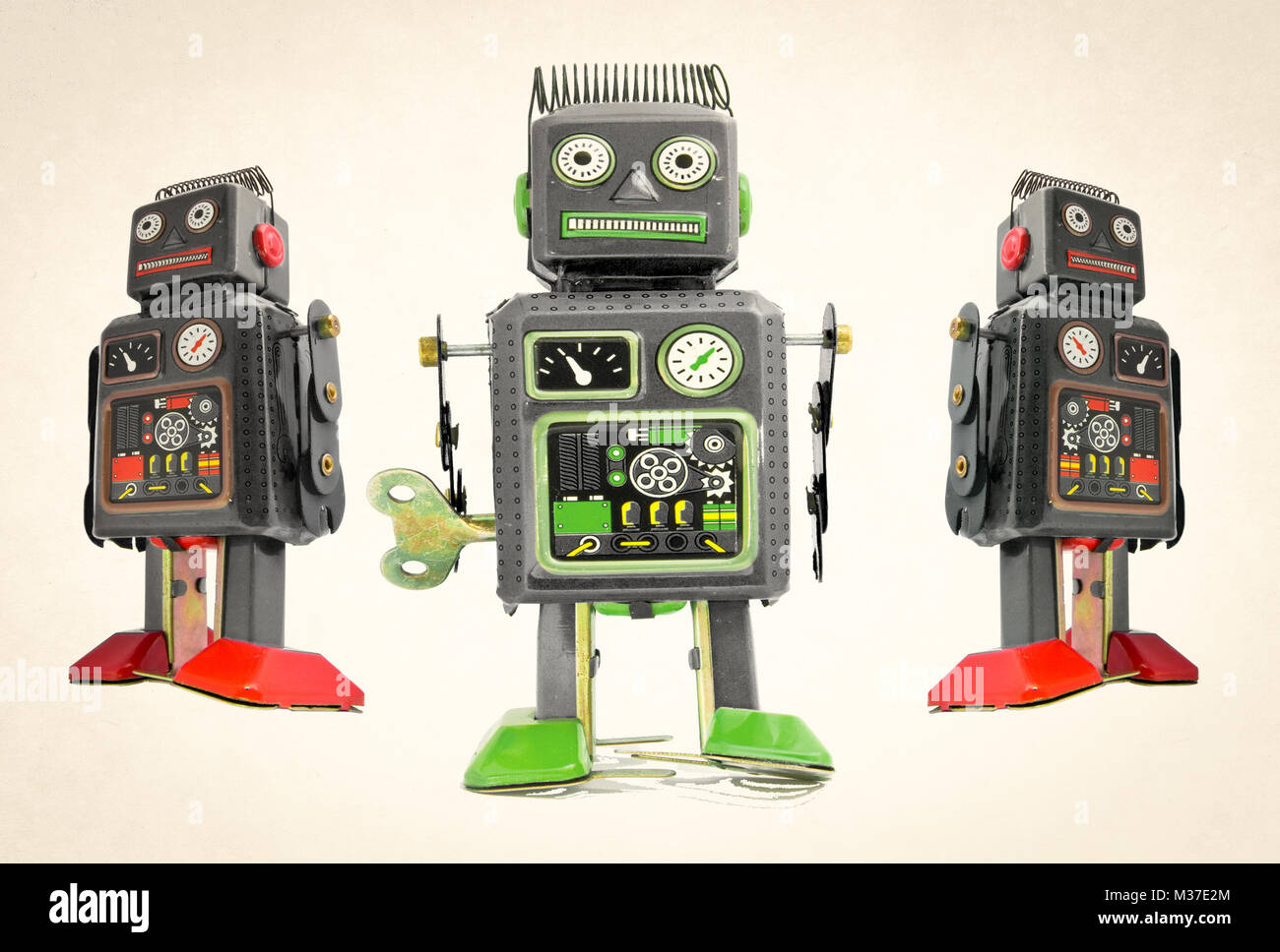 three black robot toys on white Stock Photo - Alamy