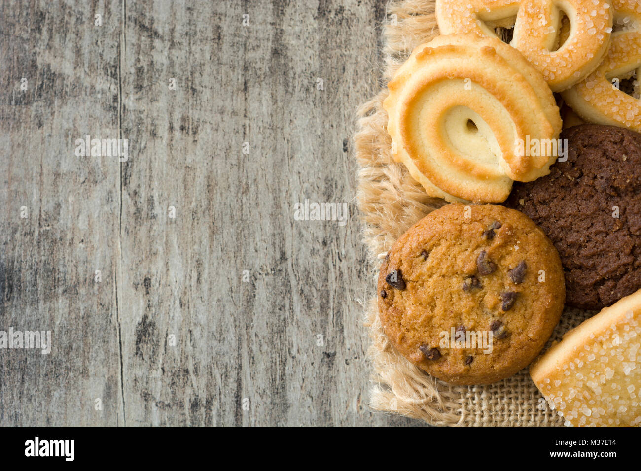 Assorted butter cookies on wooden table Stock Photo - Alamy
