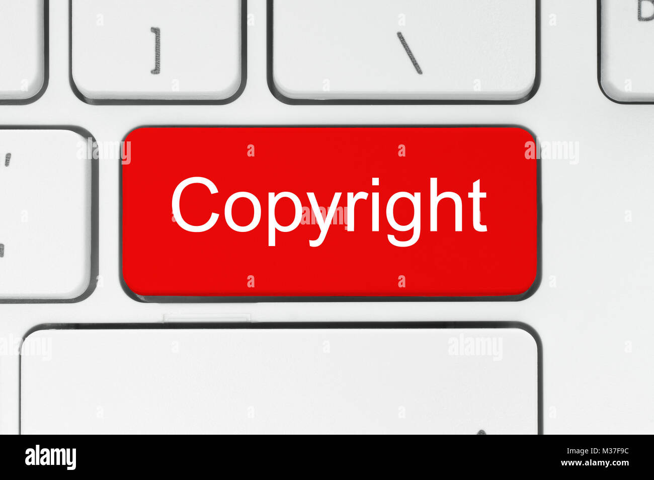 Red button with copyright word on the keyboard close-up Stock Photo - Alamy