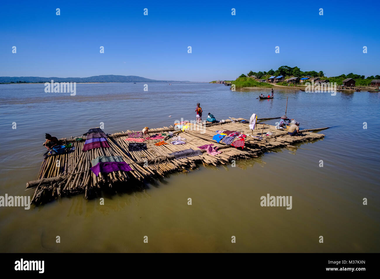 A big bamboo raft is crossing the Irrawaddy River Stock Photo - Alamy