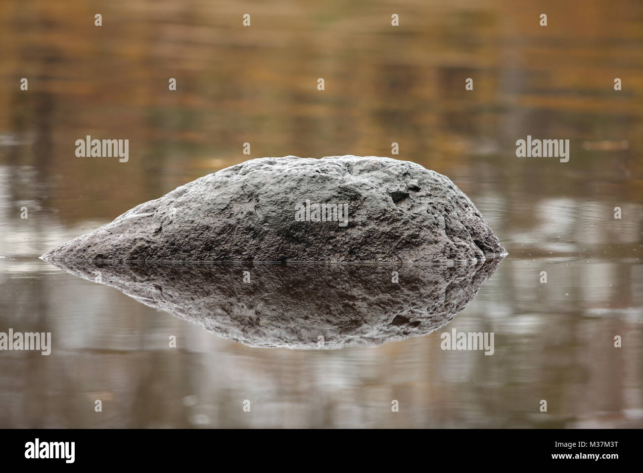 the black meteorite is reflected in water Stock Photo - Alamy