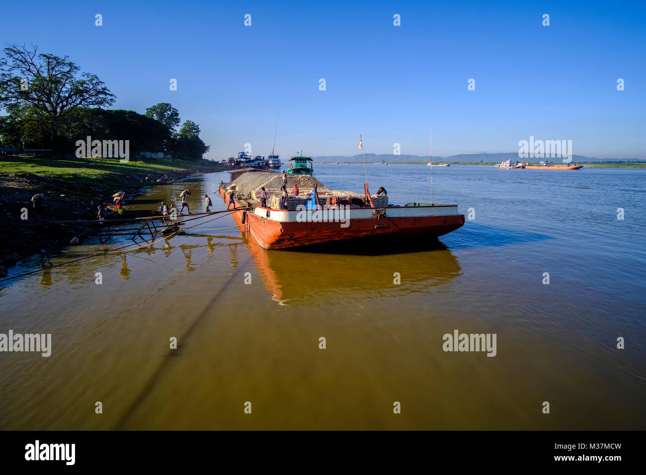 Man carrying cement bag hi-res stock photography and images - Alamy