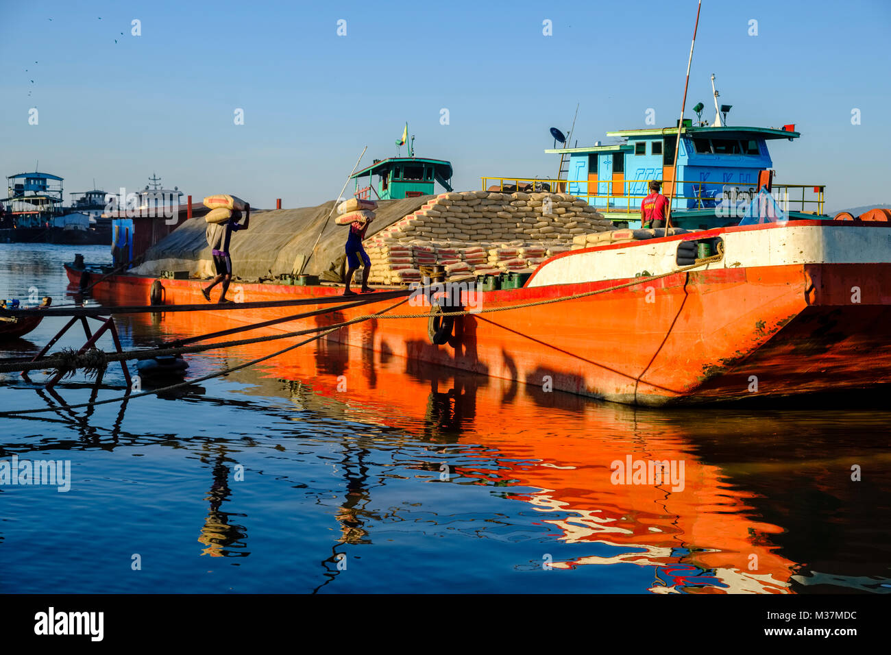 Carrying cement bags hi-res stock photography and images - Alamy