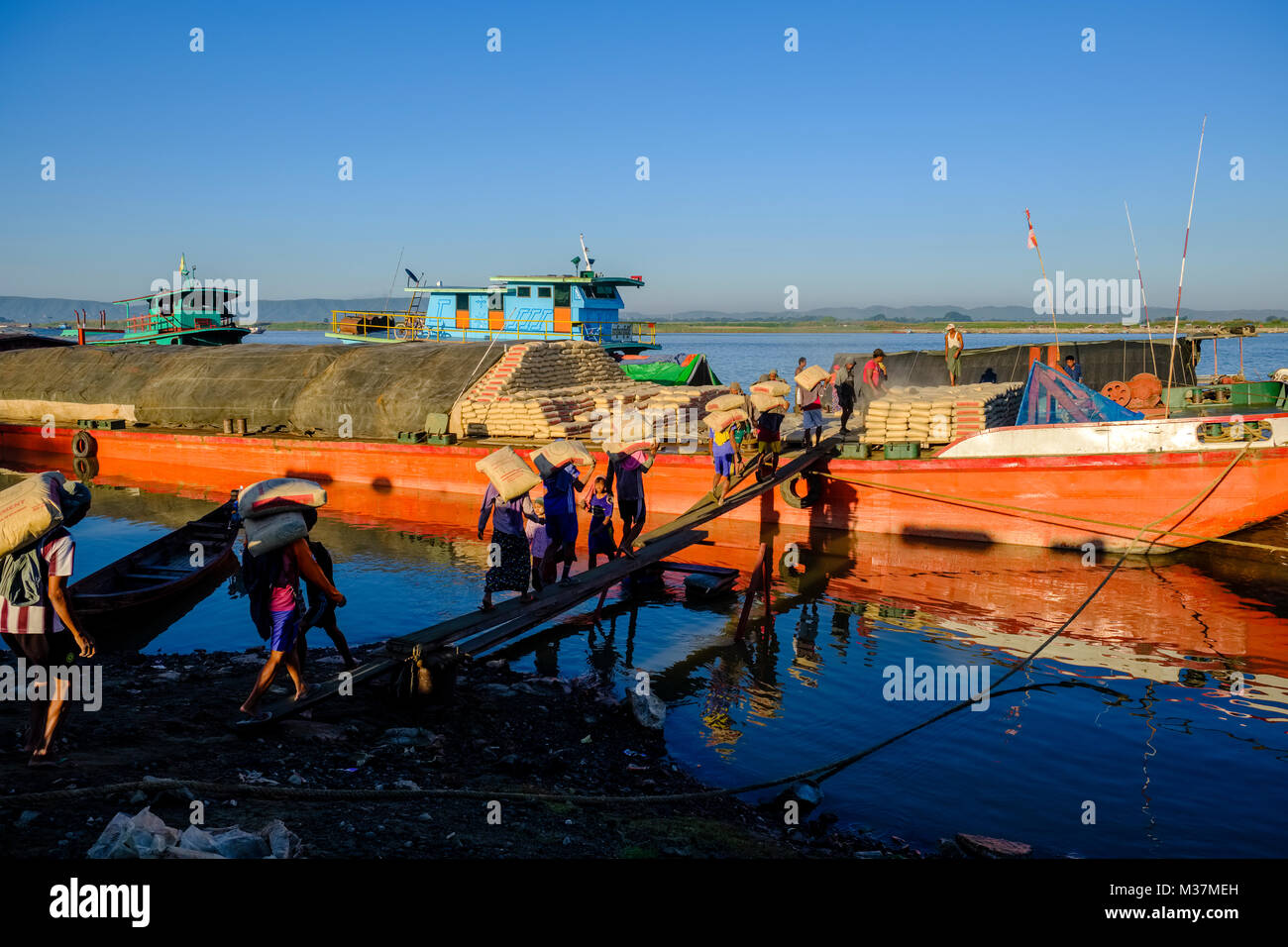 Man carrying cement bag hi-res stock photography and images - Alamy
