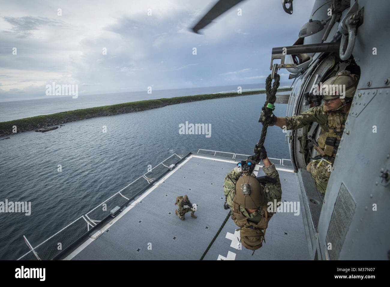 EOD sailors fast rope from an MH-60S Seahawk aboard the USNS 2nd Lt ...