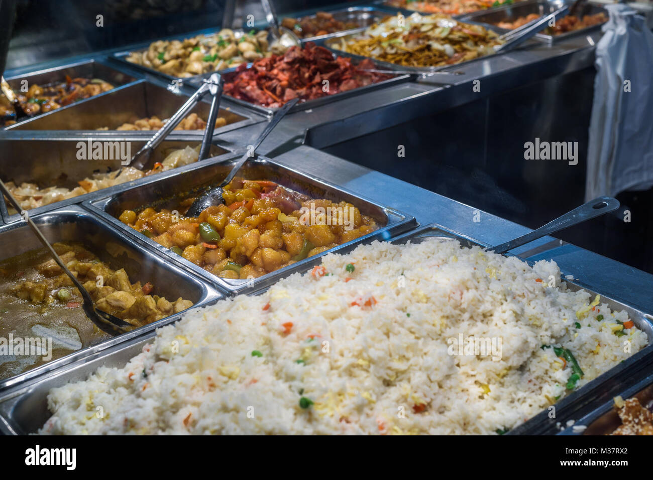 Various dishes being prepared in a Chinese takeaway kitchen Stock Photo ...