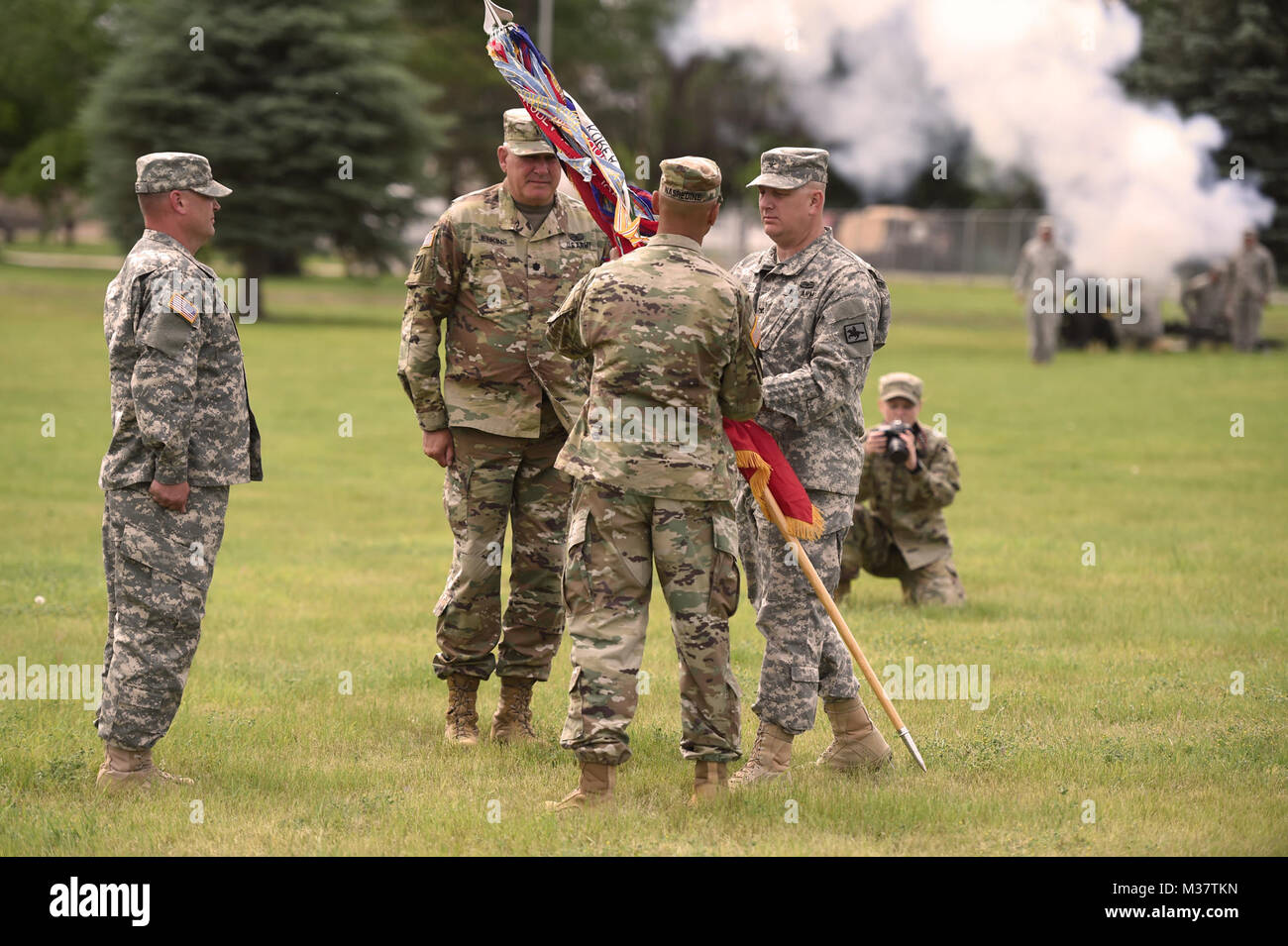 As a cannon crew fires in the background, Lt. Col. Fred Nasredine, from ...