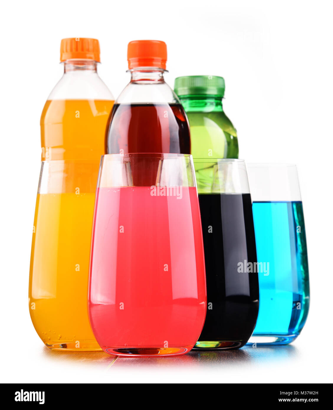 Glasses and bottles of assorted carbonated soft drinks isolated on ...