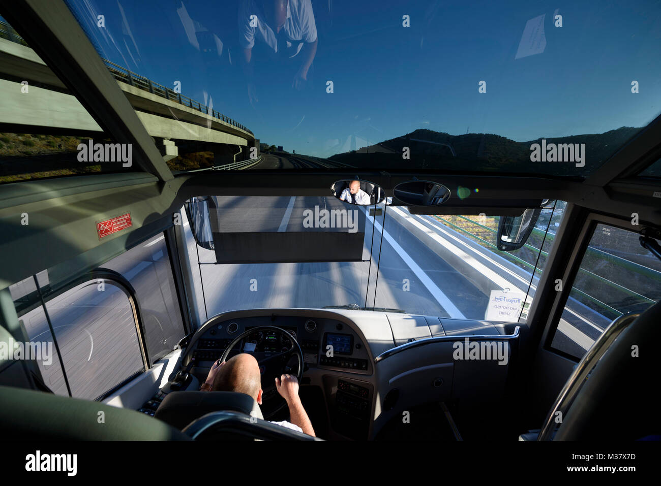 Man driving a bus Stock Photo - Alamy