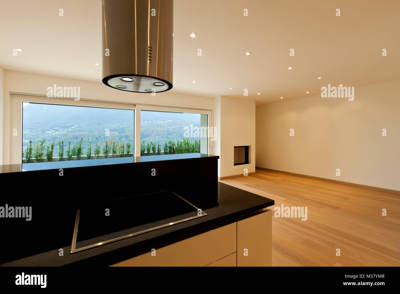 large room with kitchen island, window view Stock Photo - Alamy
