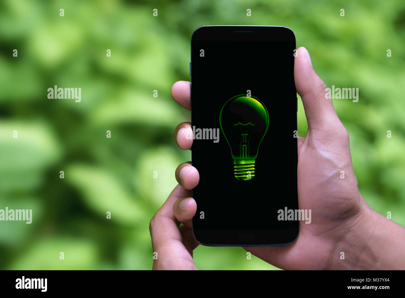 Man with mobile phone showing logos Stock Photo - Alamy