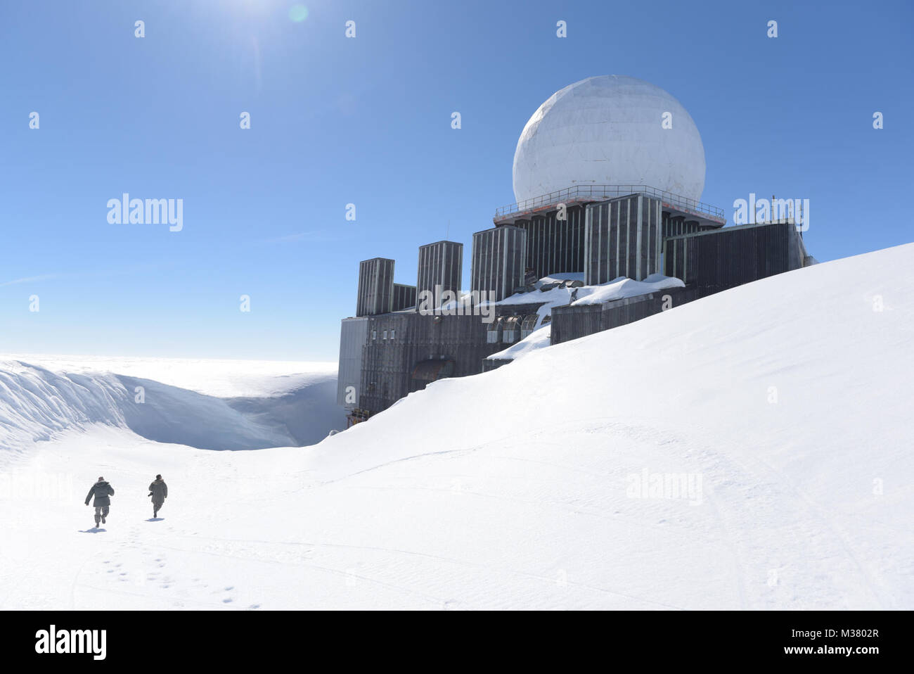 Airmen approach DYE-2, an abandoned radar site near Raven Camp that was ...