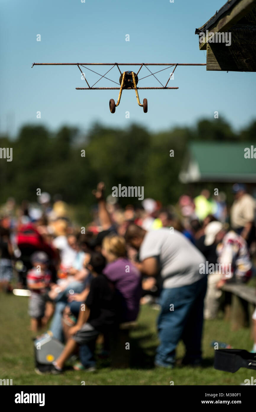 The crowd gathers on benches along the flightline at the Flying Circus ...