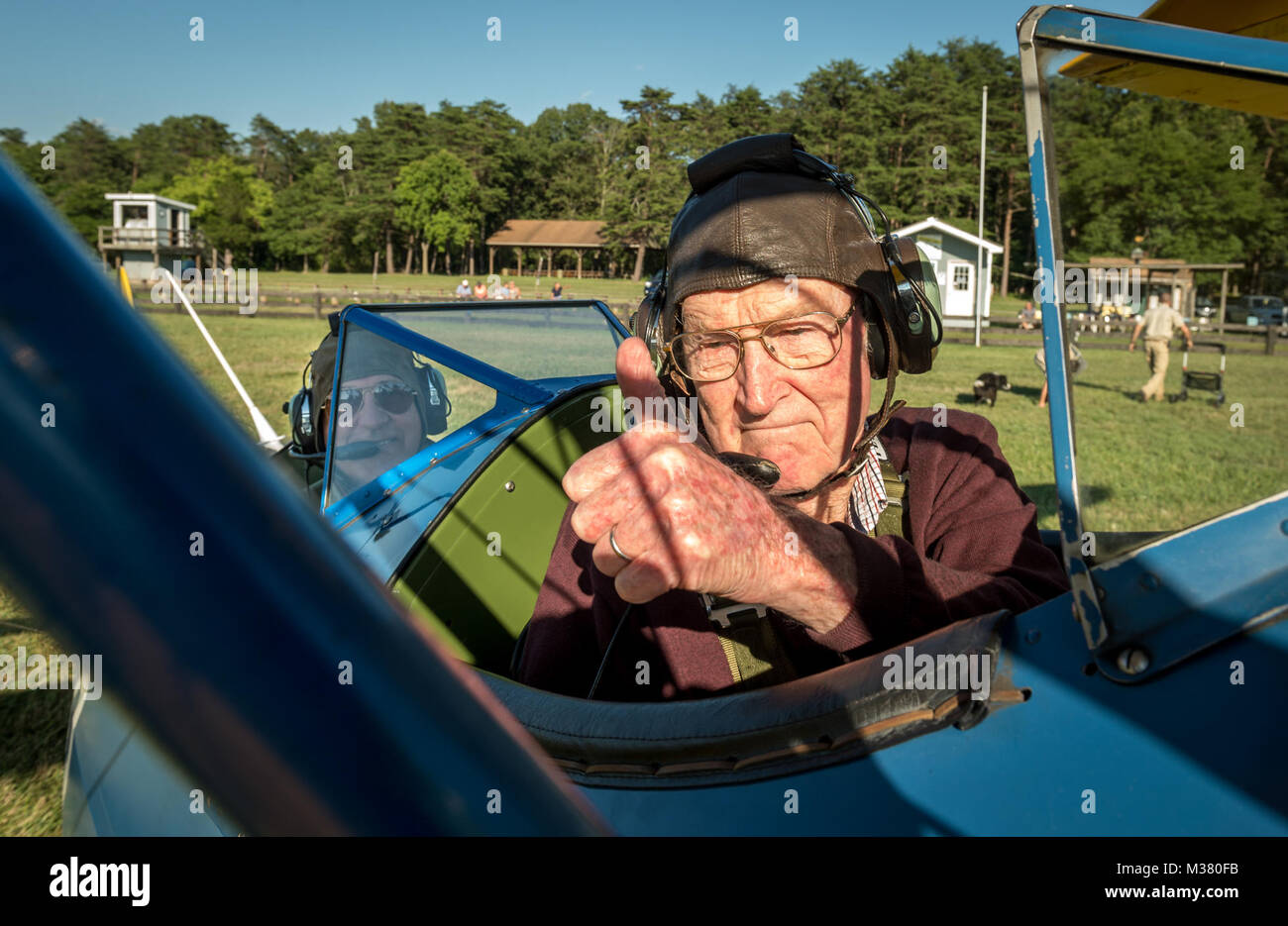 Al Tucker Jr., 96, gives a thumbs up from the front cockpit of the PT ...