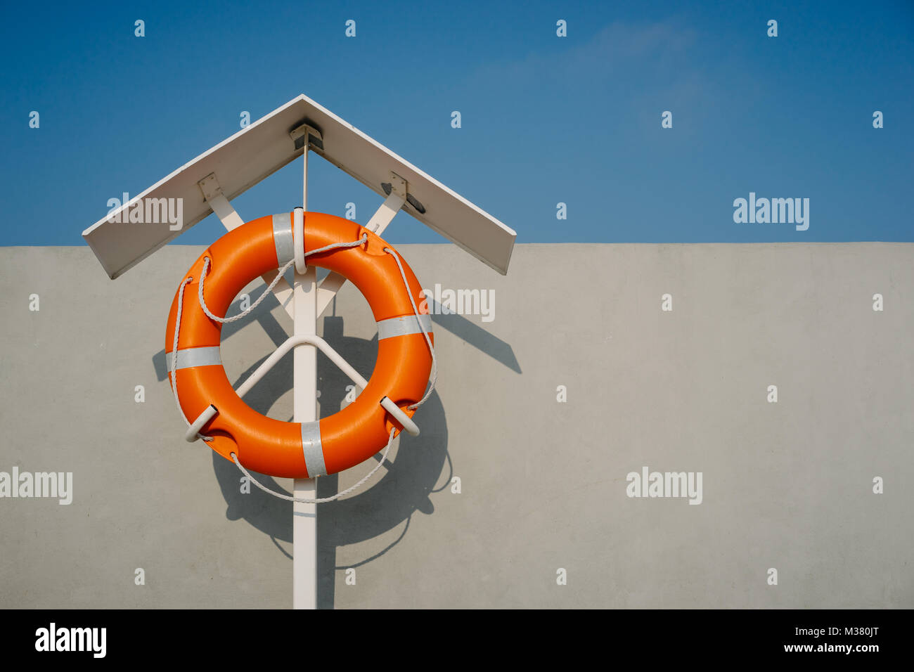 Orange lifebuoy on the pier Stock Photo - Alamy