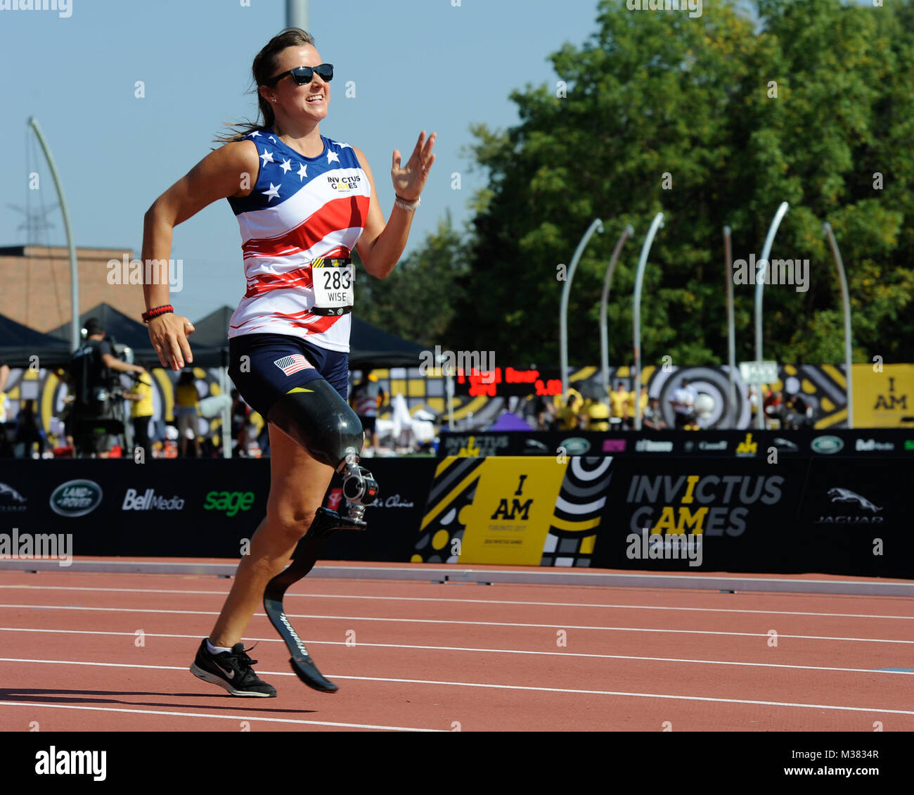 U.S. Air Force Capt. Christy Wise runs the women 100 meter dash during ...