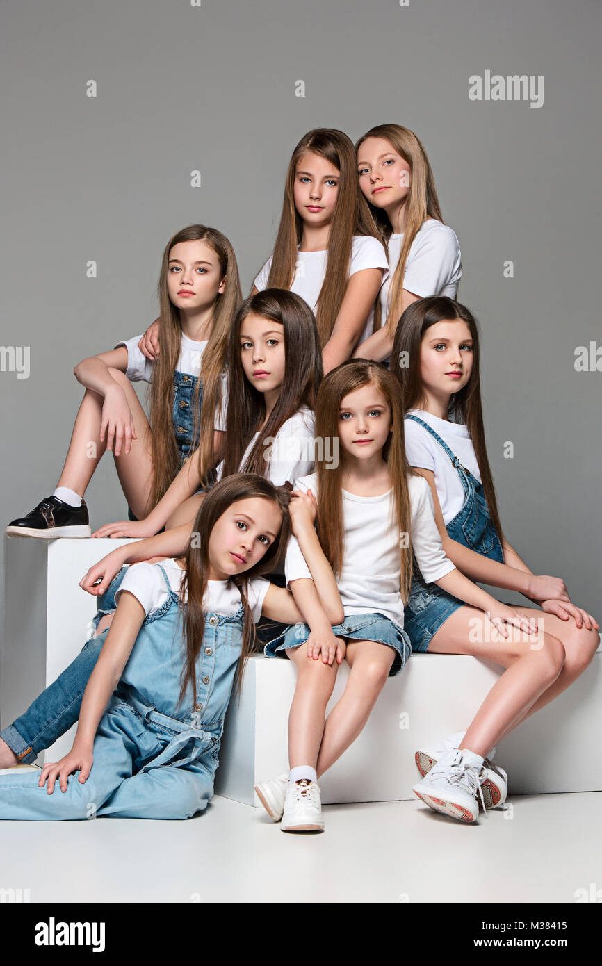 Happy girls sitting together hi-res stock photography and images - Alamy