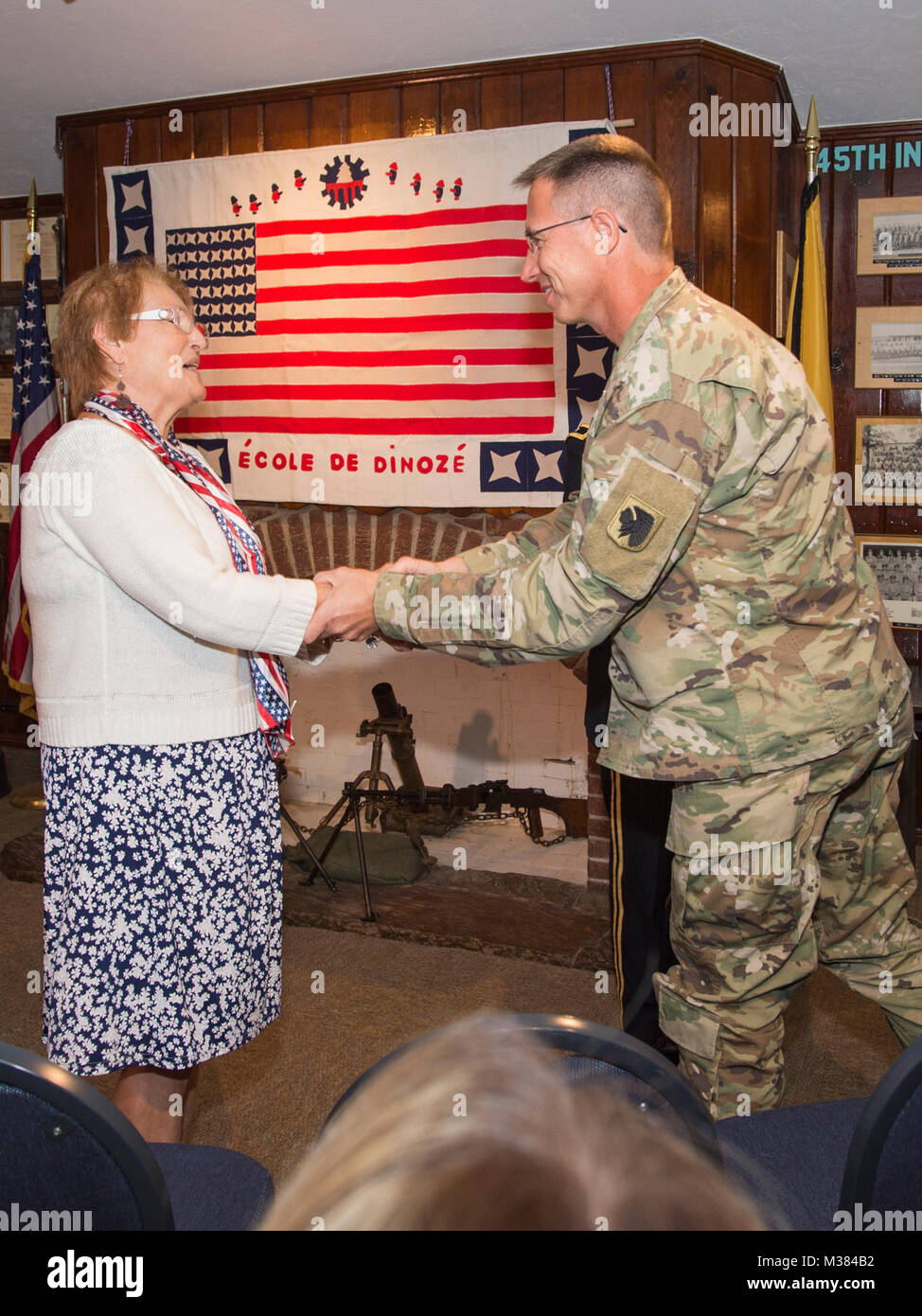Brig. Gen. Louis Wilham, Adjutant General for Oklahoma, shakes the hand ...