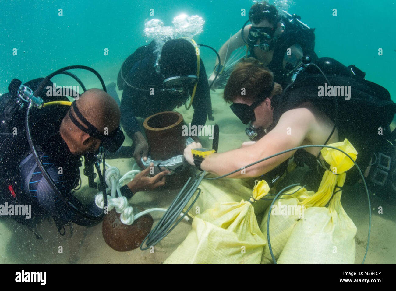 U.S. Navy Seabees, Sri Lanka Navy divers conduct demolition operations ...
