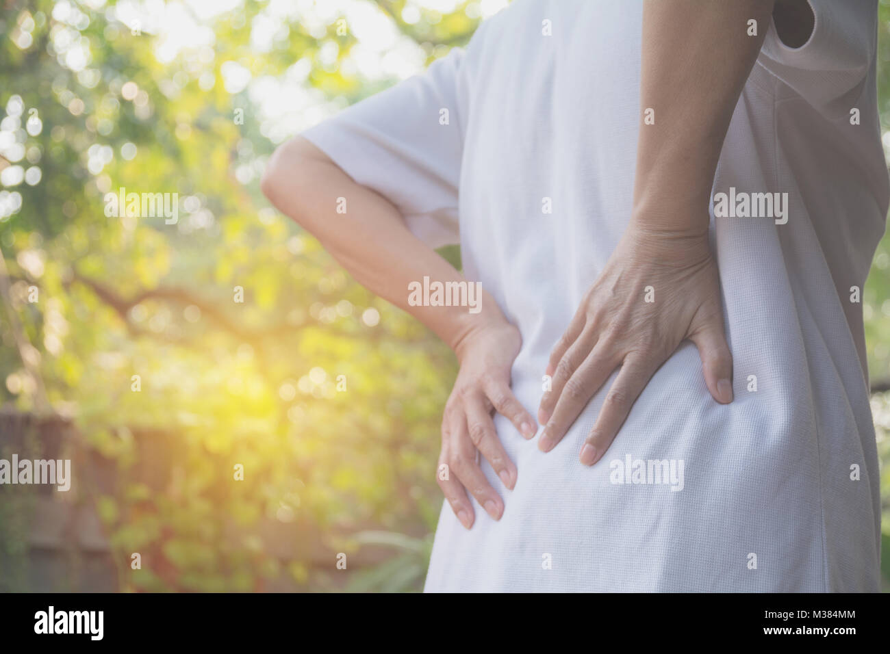 Old woman with a sore back hi-res stock photography and images - Alamy