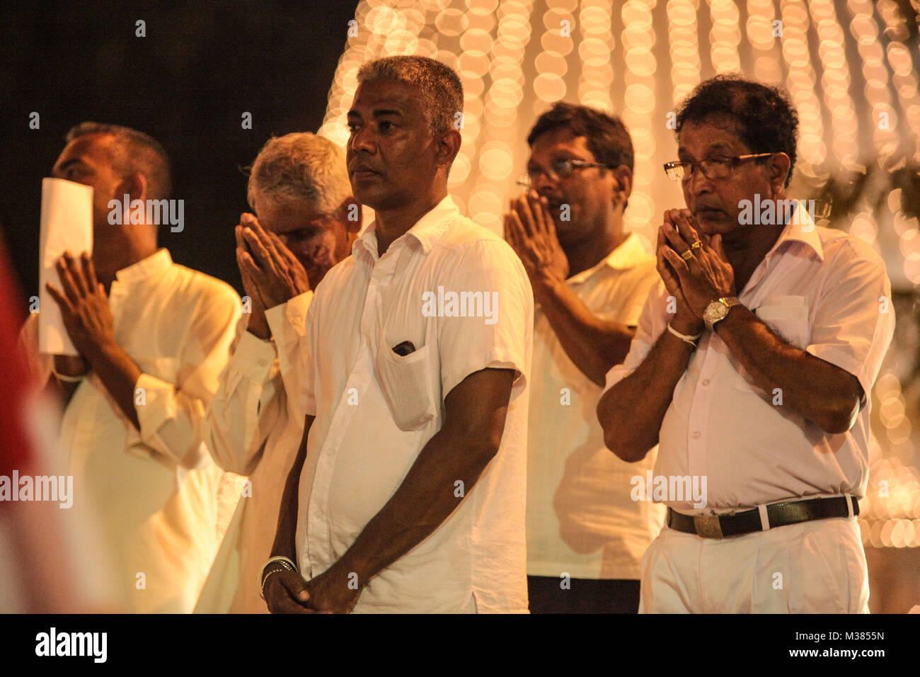 Buddhist devotees pray during festival Stock Photo - Alamy