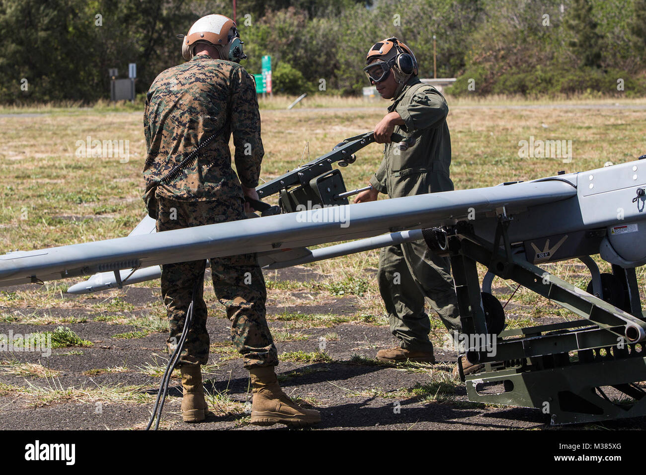 U.S. Marines with Marine Unmanned Aerial Vehicle Squadron 3, start the ...