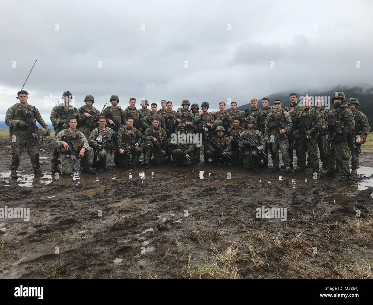 U.S. Marines pose for a group photo after finishing the live fire ...