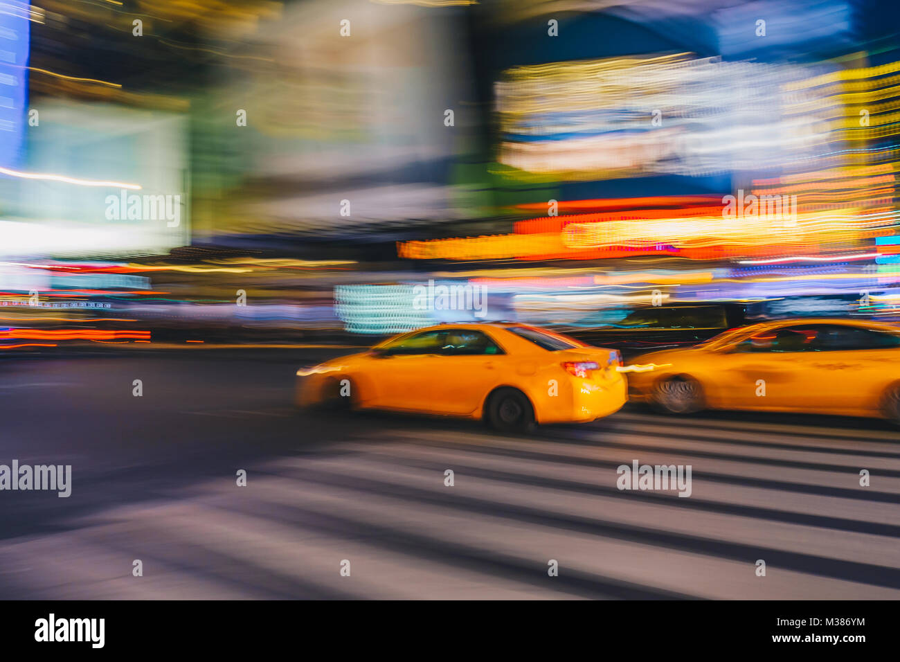 New York City - March 21, 2017 : Yellow taxi cab speeds down in a New ...