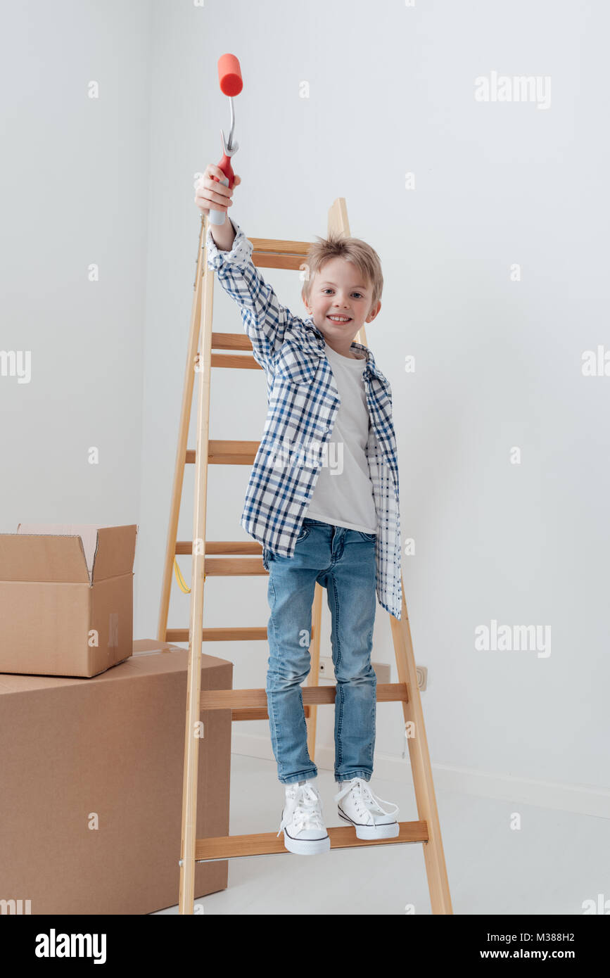Boy standing on ladder hi-res stock photography and images - Alamy