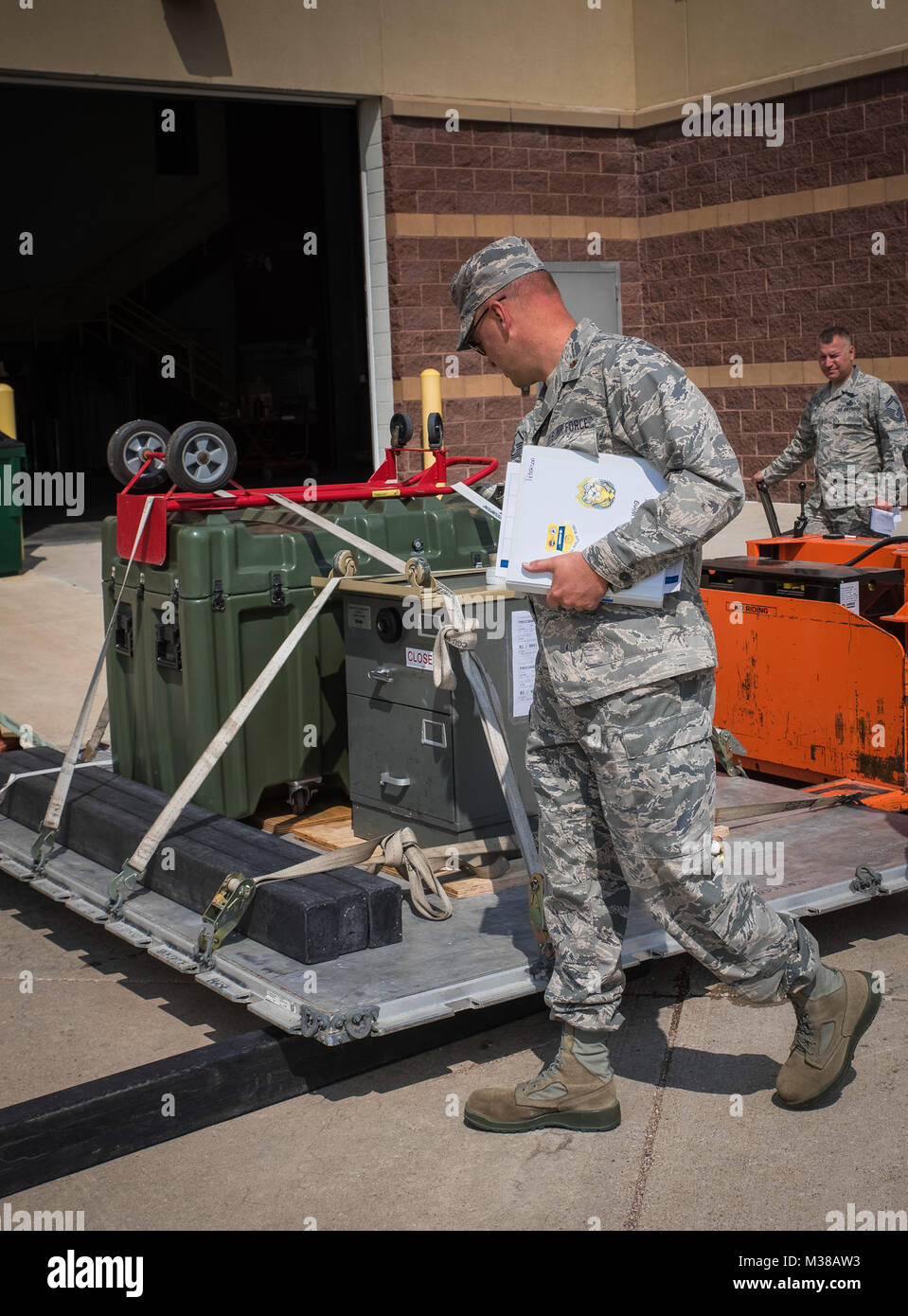Maj. James Peterson, wing inspector general inspector, inspects a ...