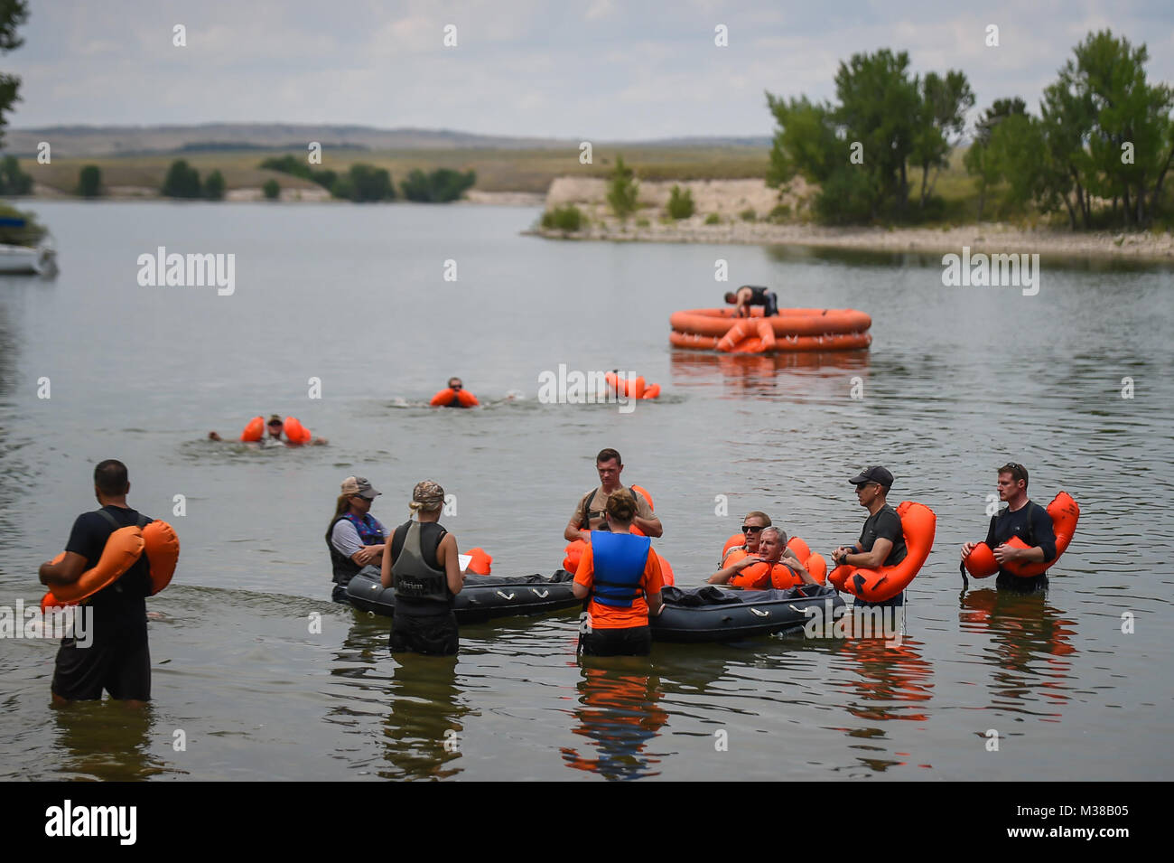 Aircrew members of the 153rd AW practice their water survival skills at ...