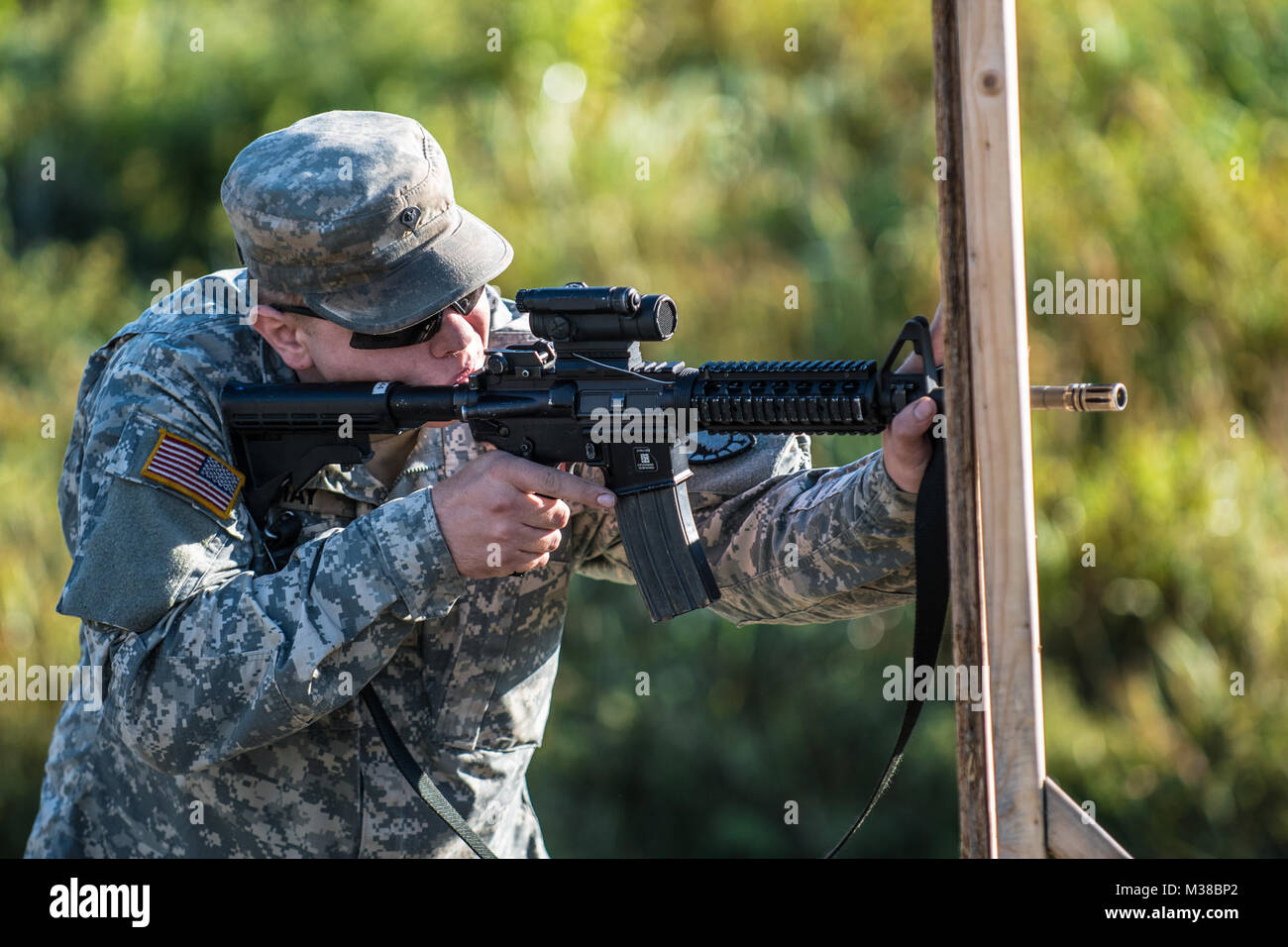 Spc. Ian May of the 251st Engineer Company (Sapper) firing his M4 ...