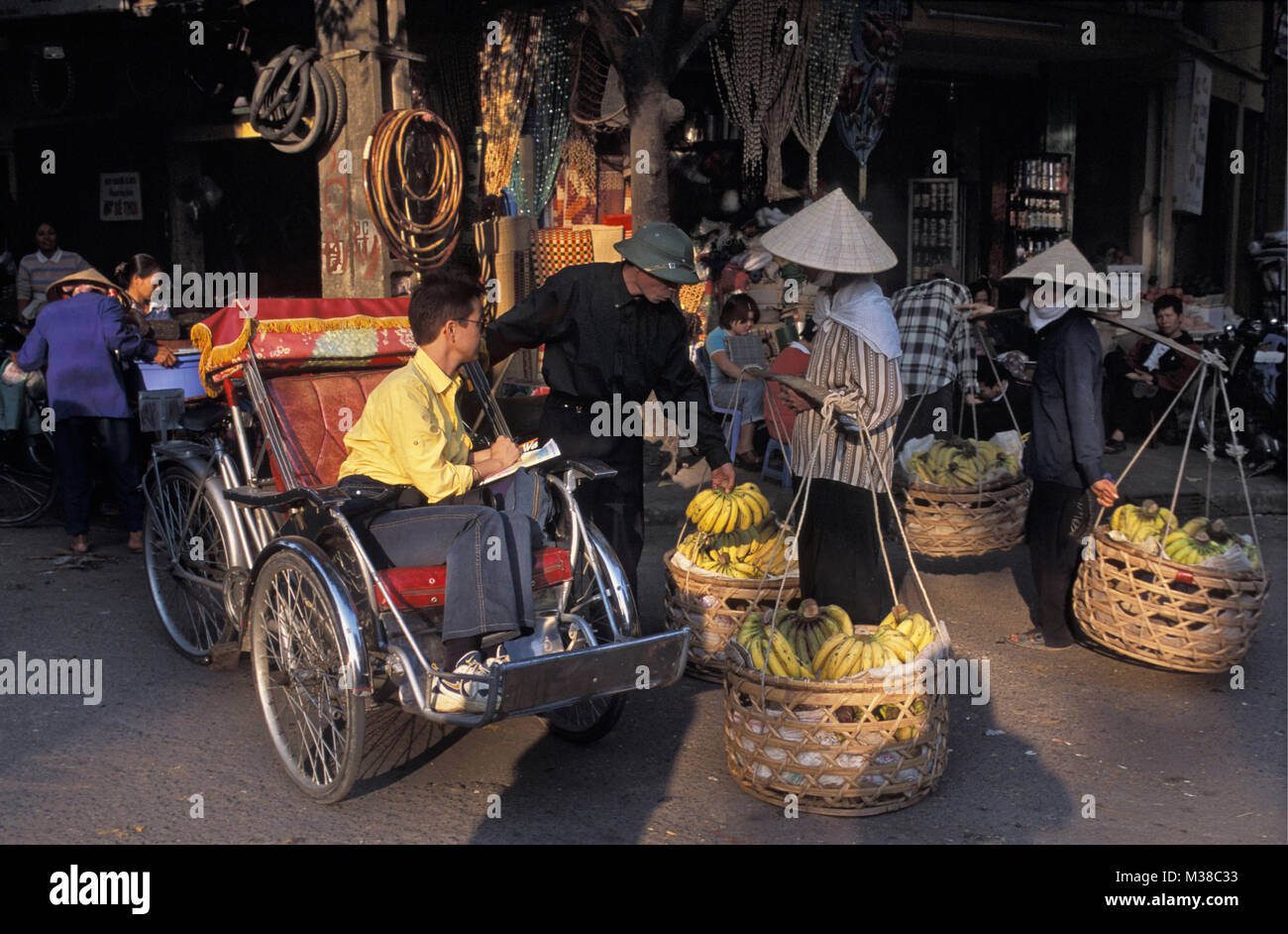 Vietnam. Hanoi. Old quarter. Rickshaw. Cyclo driver. Tourist, woman ...
