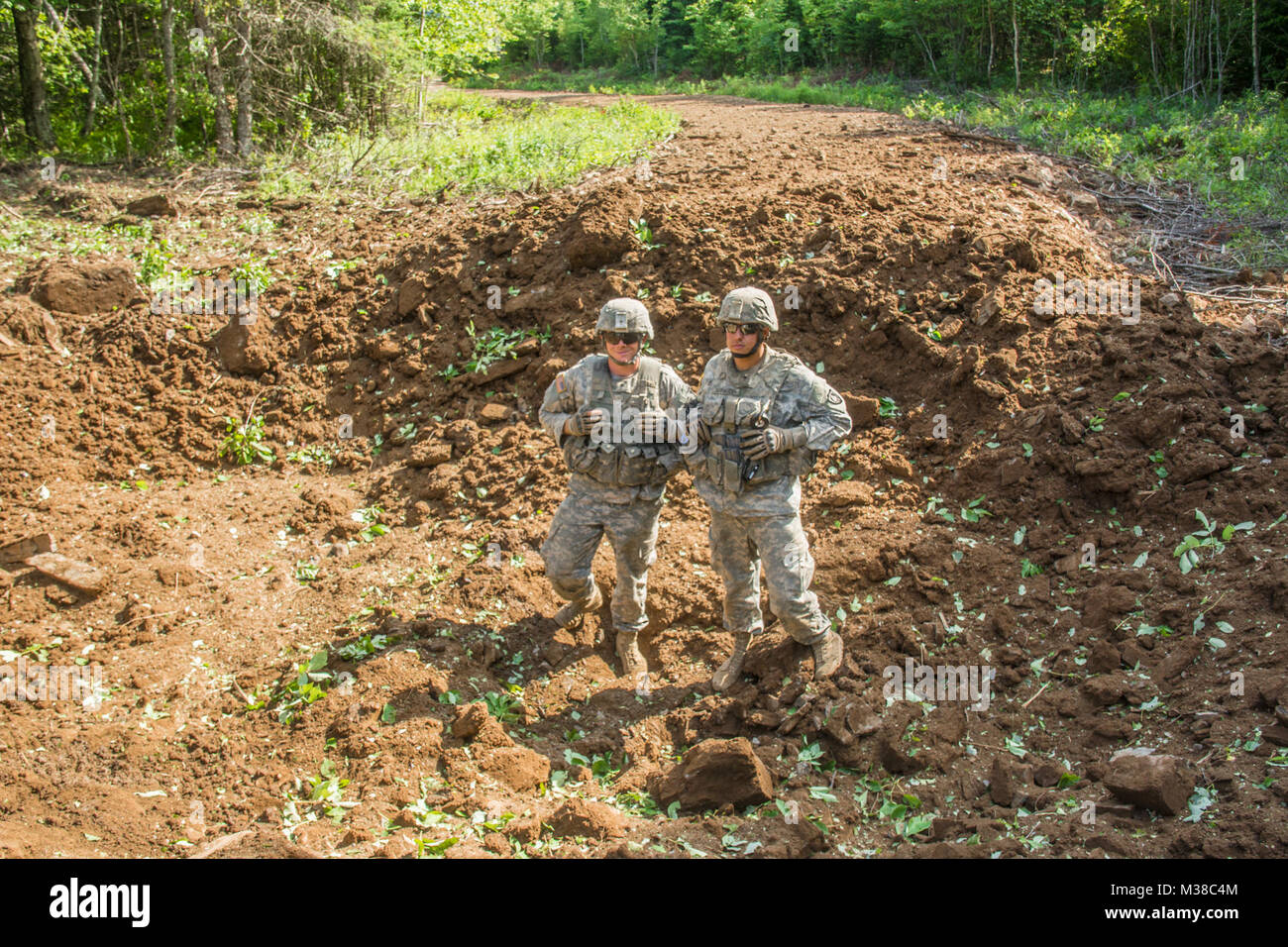 Spc. Michael Bleier and Spc. Christopher Arnaudin, combat engineers ...
