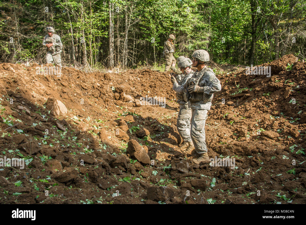 Spc. Michael Bleier and Spc. Christopher Arnaudin, combat engineers ...