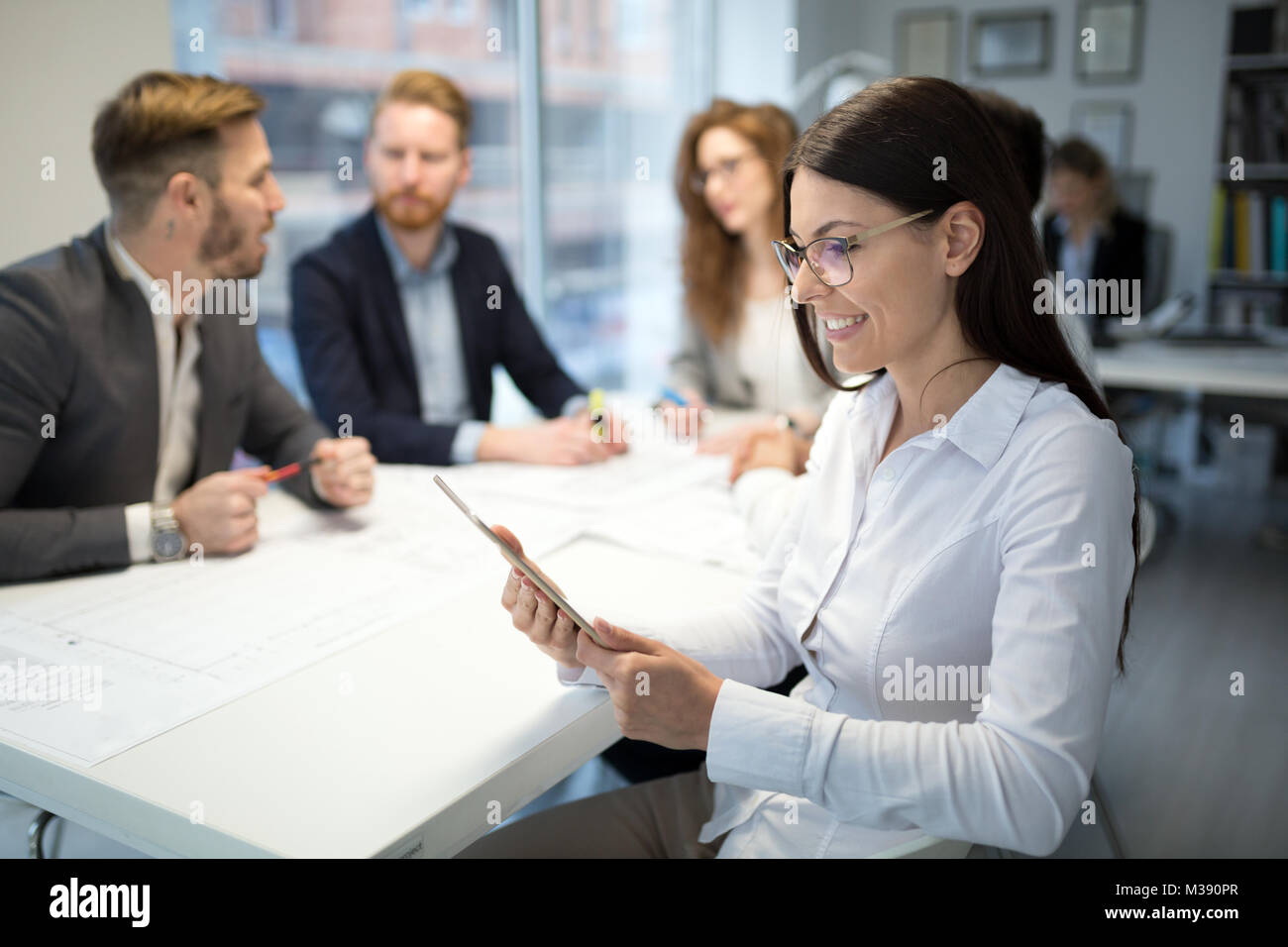 Cheerful coworkers in office Stock Photo - Alamy