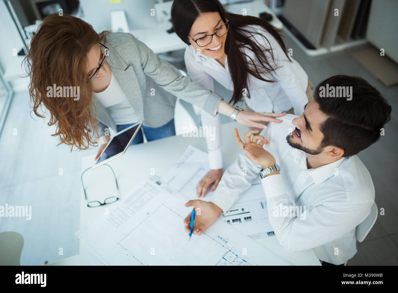 Group of architects working on project Stock Photo - Alamy