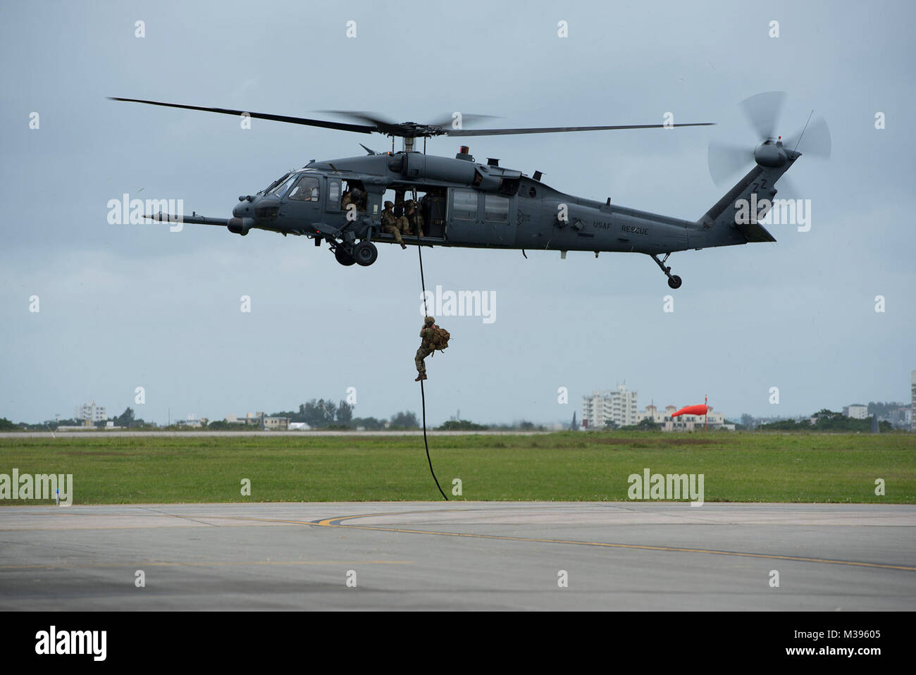 A member of the 31st Rescue Squadron performs a fast-rope exercise from ...