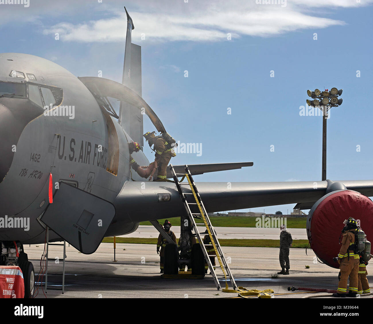 Andersen AFB Fire Department conducts an egress exercise on a KC-135 ...