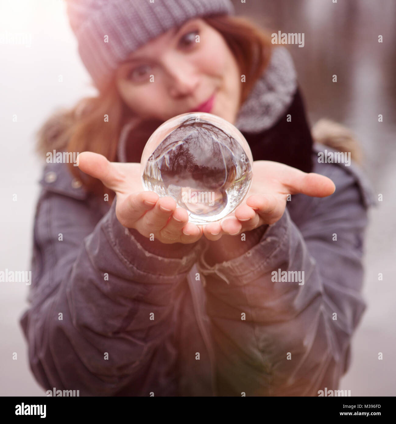 Young woman holding crystal globe hi-res stock photography and images ...