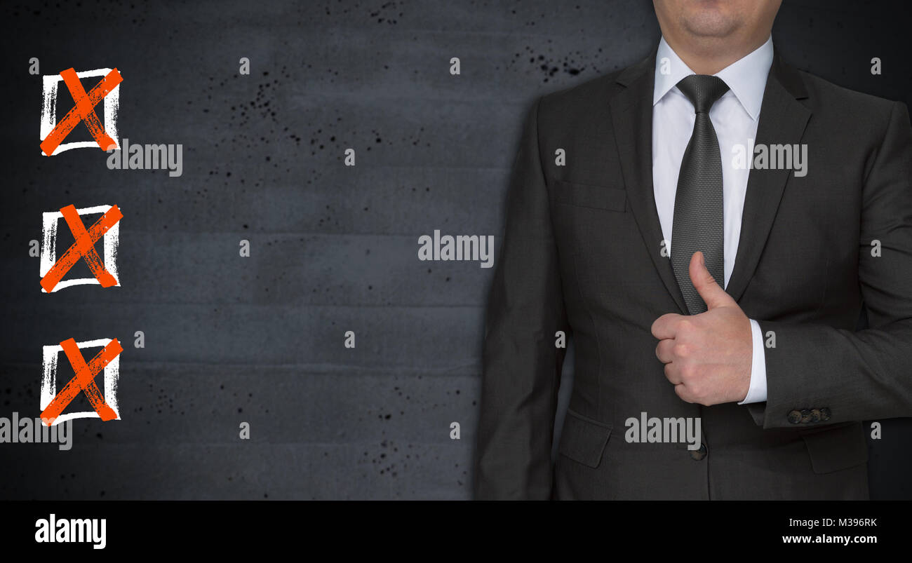Checkbox concept and businessman with thumbs up Stock Photo - Alamy