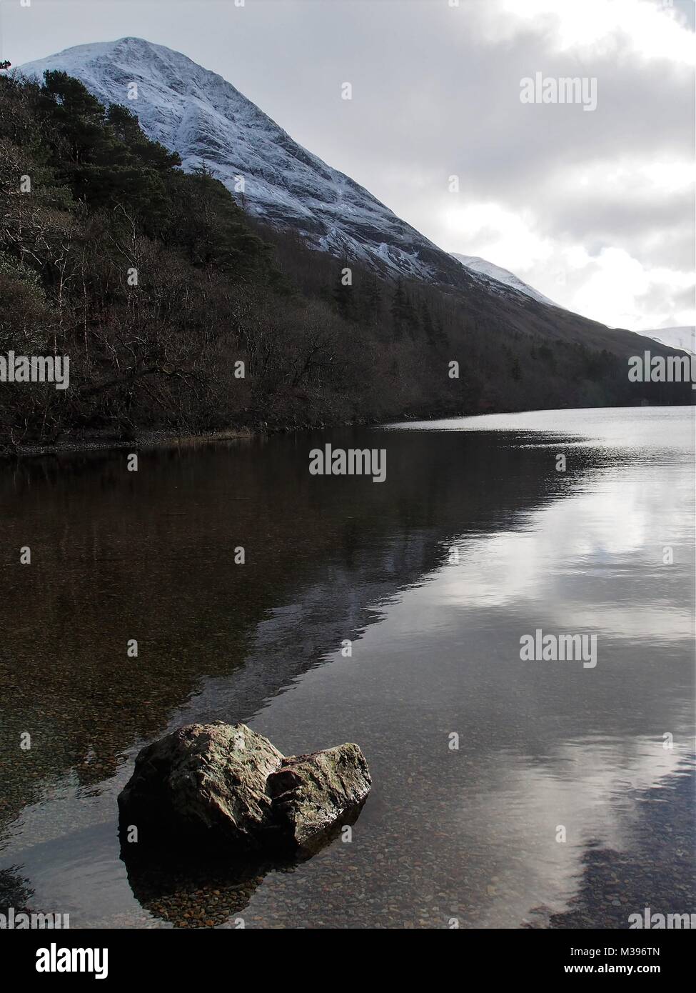 Snow covered Grasmoor reflected in Crummock Water, Lake District ...